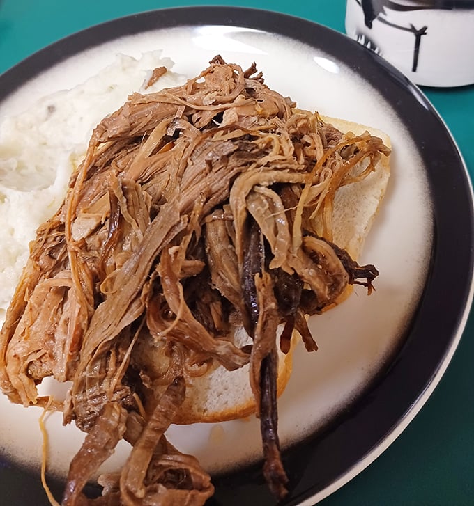 This isn't just a hot beef sandwich&mdash;it's a masterpiece of slow-roasted meat on bread, swimming in gravy that would make your grandmother weep with joy.