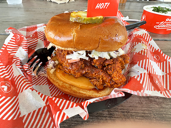 This sandwich isn't just food; it's architecture&mdash;a towering masterpiece of crispy chicken, cooling slaw, and pickles that deserves its own ZIP code.