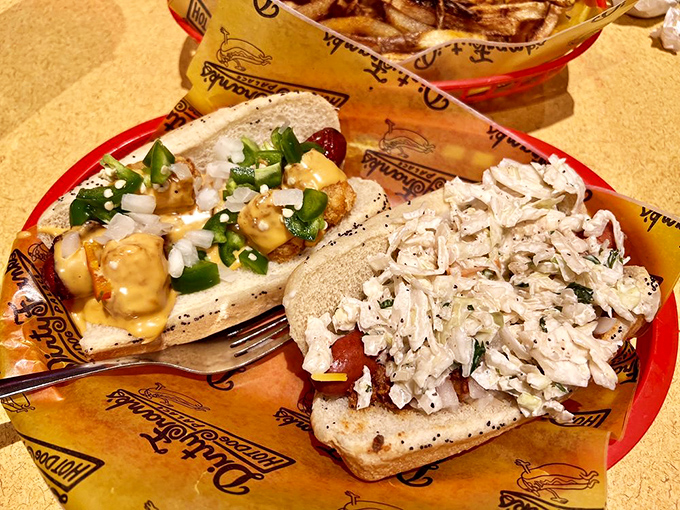 Two dogs, two different worlds of flavor. Like the Odd Couple of frankfurters&mdash;completely different personalities but somehow perfect roommates on that red plate.