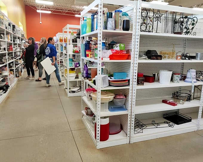 Housewares heaven where shoppers hunt with the intensity of archaeologists. That perfect serving platter is hiding somewhere between the mugs and mixing bowls.