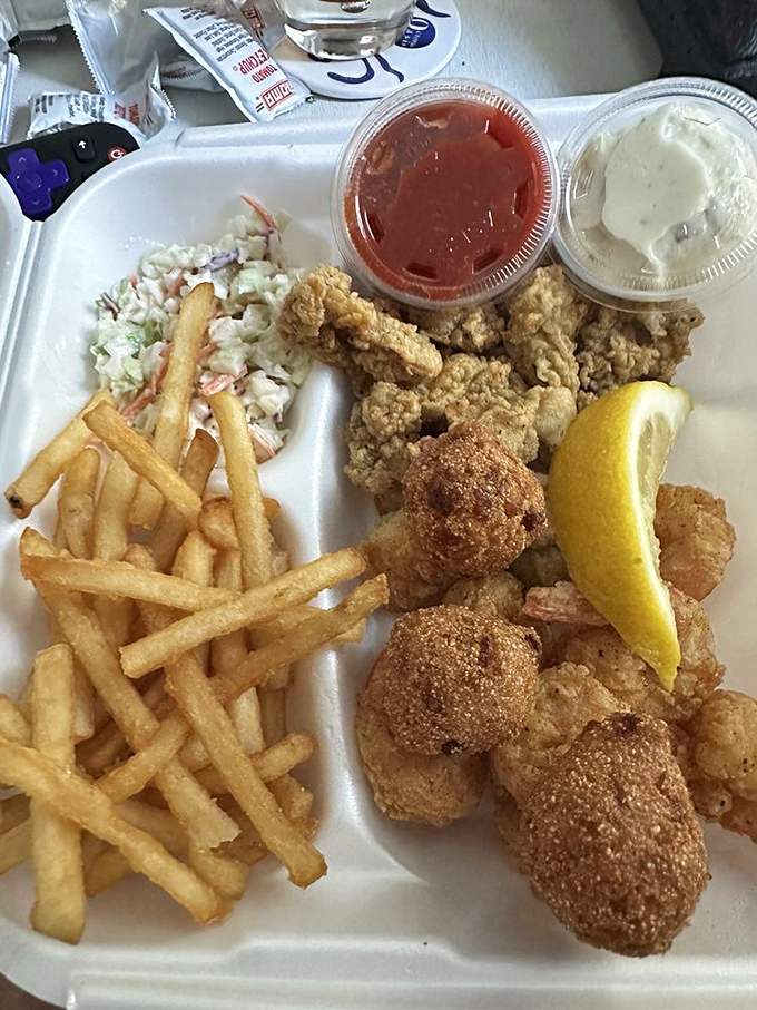 Golden-fried perfection that would make Neptune himself swim to shore. Those hush puppies aren't just side dishes&mdash;they're little spheres of Southern happiness.