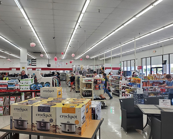 Pink decorations dangle from the ceiling as shoppers navigate aisles of kitchen appliances &ndash; including enough Crockpots to slow-cook meals for the entire state.