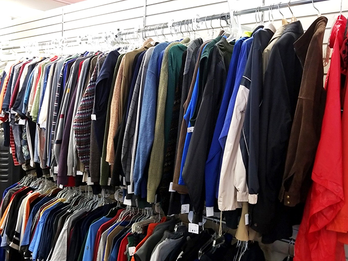 The men's section defies thrift store stereotypes with quality jackets that look like they just stepped out of a vintage GQ spread.
