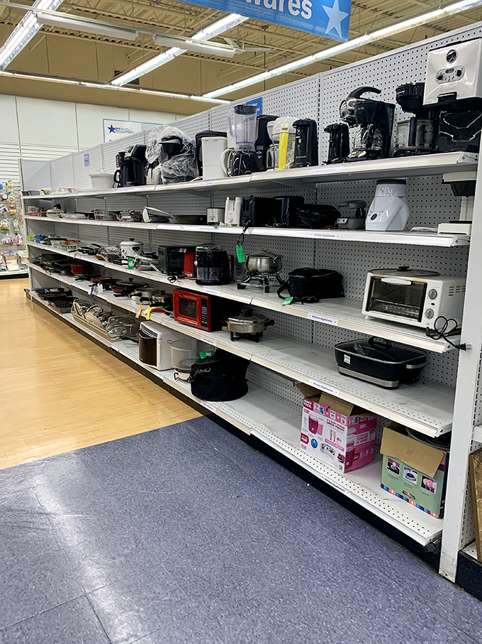 Kitchen appliance heaven or small appliance purgatory? One shopper's cast-off coffee maker becomes another's morning salvation, all neatly arranged on pegboard shelves.