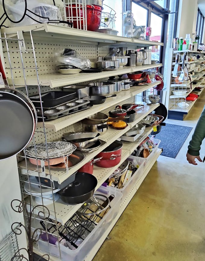 Pots and pans galore! Julia Child would have a field day exploring these shelves of culinary possibilities.