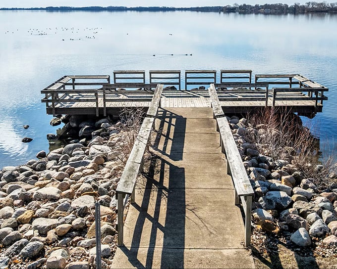 Storm Lake's waters stretch endlessly, proving you don't need an ocean for those perfect sunset moments.