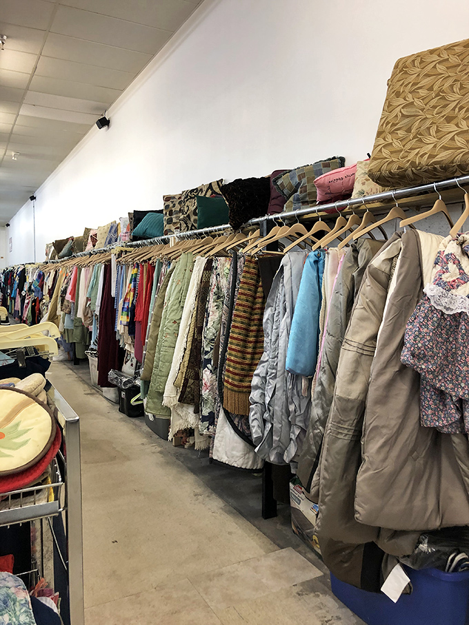 Coats, jackets, and linens lined up like soldiers ready for inspection—each with a story and a second chance at making someone's wardrobe complete.