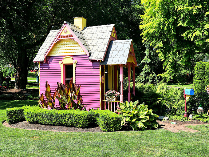 Barbie's dream cottage got a makeover! This whimsical pink playhouse brings a pop of unexpected color to the otherwise natural landscape.