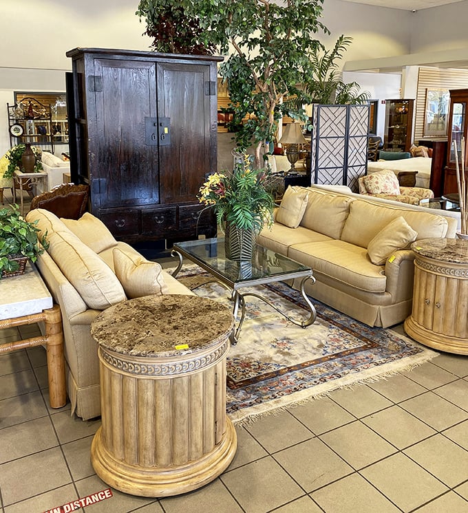 Sophisticated living room setups that whisper "Naples luxury" while shouting "incredible bargain"&mdash;complete with classical columns and lush greenery.