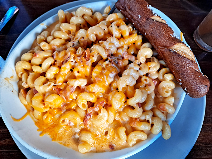 Mac and cheese that doesn't mess around: creamy, decadent, and served with a side of garlic bread for necessary sauce-mopping duties.