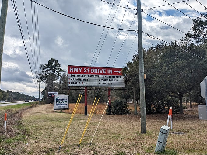 The roadside marquee announces tonight's features like a town crier of entertainment. Three movies for the price of one? Count me in!