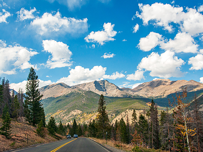 Blue skies meet jagged horizons at this pull-off, where visitors gather to collectively gasp at nature's grandeur.