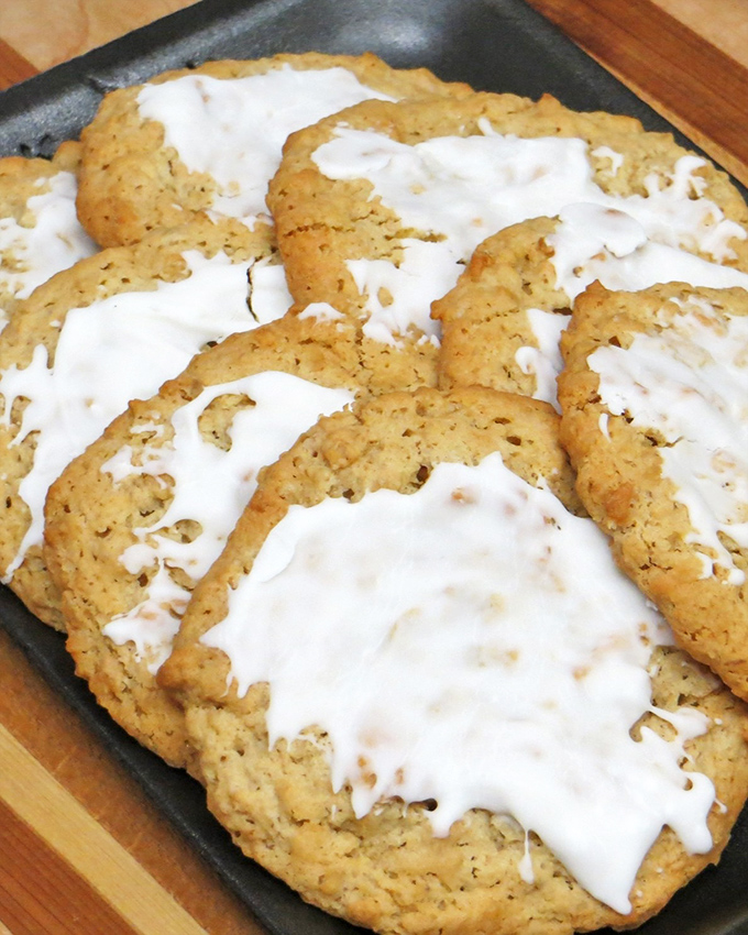 Oatmeal cookies that look like they've been blessed by the dairy gods. That glaze isn't just icing&mdash;it's the difference between a good day and a great one.