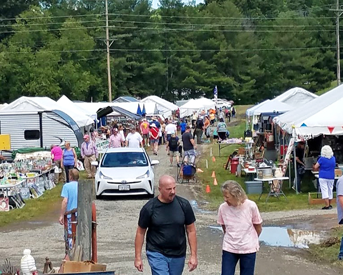 The market stretches as far as the eye can see – a temporary city of tents where treasures and memories wait around every corner.