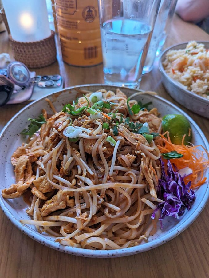 Behold the Pad Thai in all its glory: perfectly tangled noodles, fresh garnishes, and that crucial lime wedge waiting patiently.