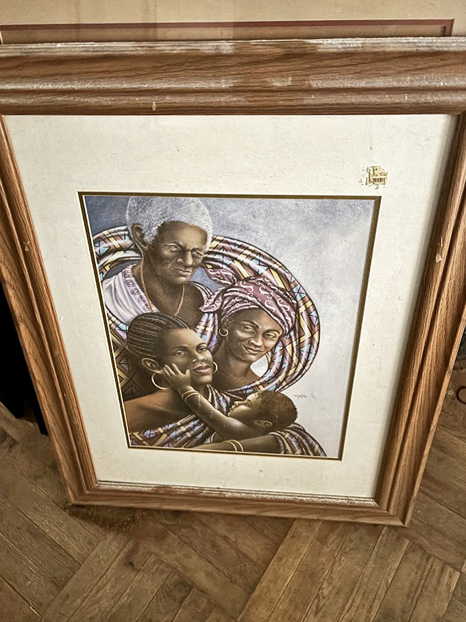 Art that once adorned someone's living room wall now waits for a new home, telling stories we can only imagine.