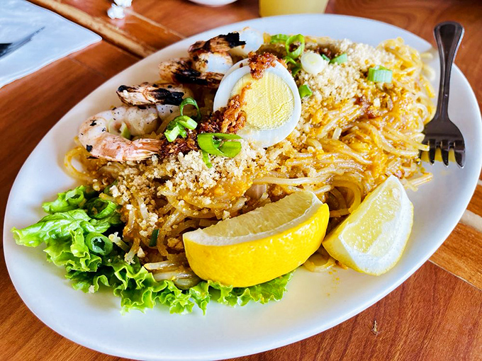 Pancit Palabok that would make your grandmother weep with joy. Those plump shrimp and that perfect egg aren't just toppings&mdash;they're a declaration of culinary love.