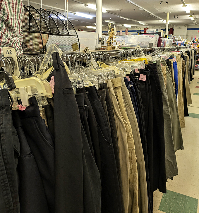 The pants section: where khakis from three decades hang in perfect harmony, a textile timeline of America's relationship with acceptable casual wear.
