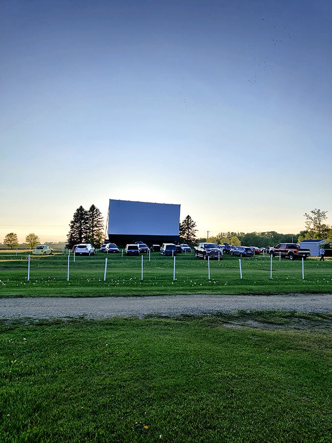 The white fence creates a perfect frame for the Starlite's screen, standing sentinel against the encroaching digital age.