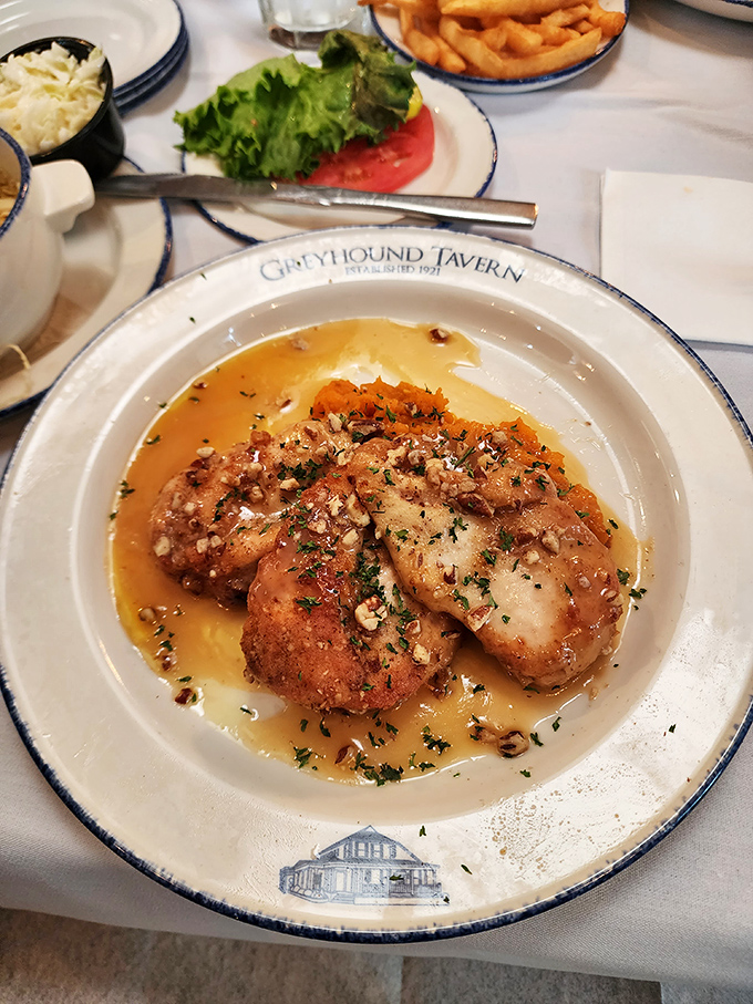 This pecan-crusted chicken swimming in buttery sauce isn't just dinner&mdash;it's edible proof that sometimes the best things in life require a napkin tucked into your collar. 