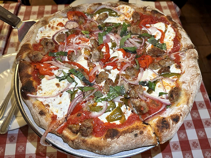 This isn't just pizza with sausage &ndash; it's a masterclass in coal-fired perfection with that signature char that makes New Yorkers swoon.
