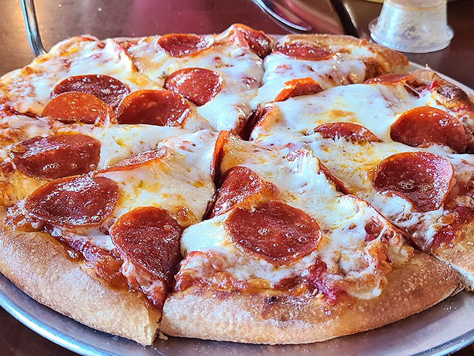 Golden pepperoni cups pooling with spicy oil on bubbly cheese&mdash;this is what pizza dreams are made of, folks.