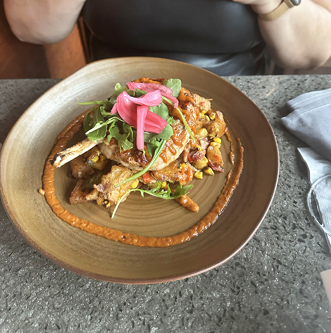 Not your grandmother's pork dish. This masterpiece of meat sits like edible artwork, with pickled garnishes adding that perfect punch of color.