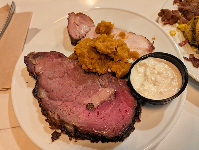 The prime rib arrives like a carnivore's dream &ndash; perfectly pink, seasoned edge, with sides playing supporting roles they've clearly rehearsed for years.