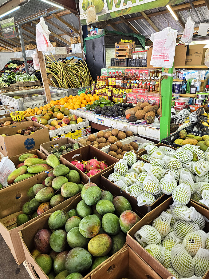 A produce paradise! Mangoes, avocados, and tropical fruits create a colorful mosaic that puts supermarket selections to shame.