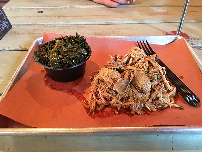 Pulled pork that surrenders at the touch of your fork, paired with collard greens that have clearly been on a first-name basis with smoked meat.