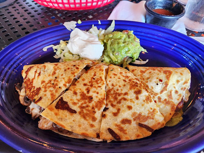 This quesadilla isn't playing games&mdash;golden-brown tortilla giving way to melty cheese and savory fillings, with guacamole standing by for backup.