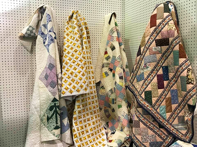 Handcrafted quilts hang like textile time capsules, each stitch representing hours of artistry and patience that modern manufacturing simply can't replicate.