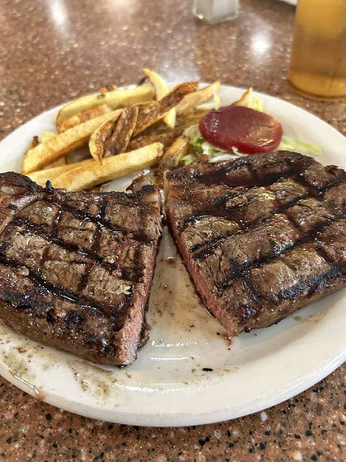 This isn't just steak &ndash; it's a masterclass in meat. Ray's ribeye arrives with perfect grill marks and fries that could make a potato proud.