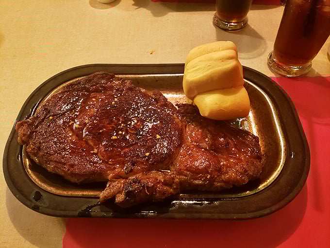 This isn't just a ribeye&mdash;it's a masterpiece of marbling, seared to perfection and served with rolls that demand to be torn apart.