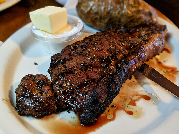 Behold the star of the show&mdash;a perfectly seared ribeye that makes vegetarians question their life choices. That pat of butter slowly melting on top is nature's perfect sauce.