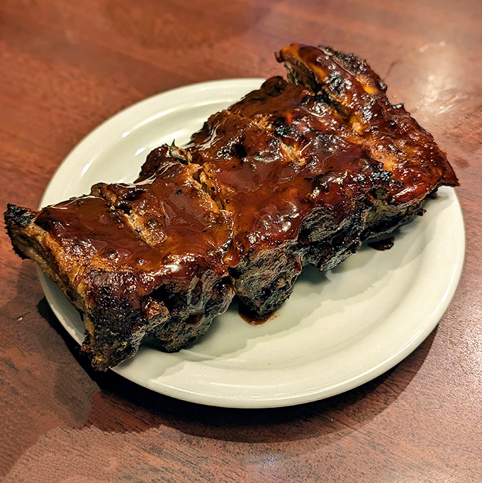 These ribs don't "fall off the bone"&mdash;they resist just enough to remind you that proper barbecue requires both patience from the pitmaster and a little work from you.