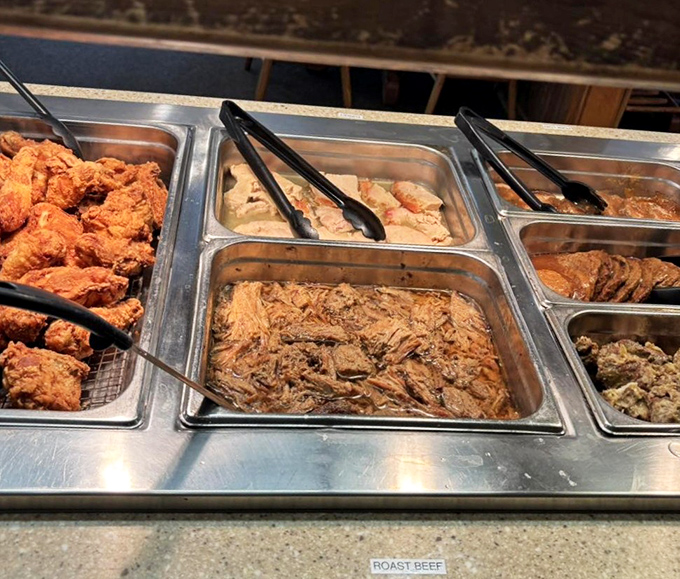 Behold the star of the show! The roast beef waits patiently in its buffet tray, knowing full well it's about to make someone's day exponentially better.