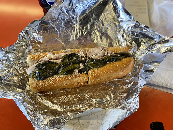 This isn't just a roast pork sandwich&mdash;it's a masterclass in balance, where tender meat meets bitter greens in a harmony that makes taste buds applaud.