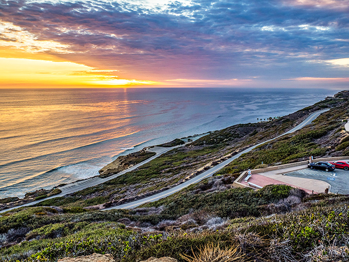 That golden California moment when the sun bids farewell, painting the coastline in hues that would make even Monet put down his brush in awe.