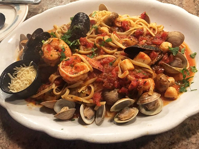 This seafood linguine isn't just a meal, it's a Mediterranean vacation on a plate—mussels, clams, and shrimp throwing a party in tomato sauce.