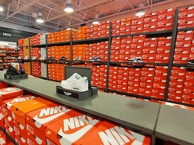 Wall-to-wall Nike boxes create a sneakerhead's dream landscape. Somewhere in this orange kingdom lies your perfect pair at a not-so-perfect price.