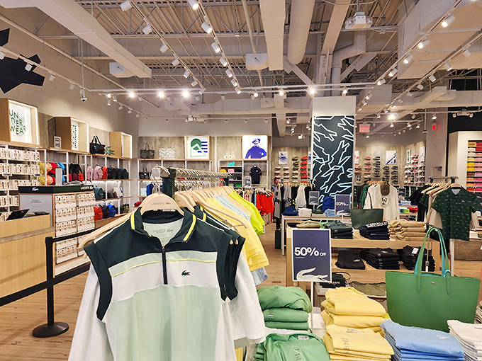 Inside the Lacoste store, a rainbow of polos stands at attention like colorful soldiers guarding the gateway to preppy paradise. That 50% off sign is practically winking at you.