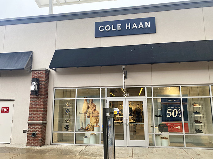 Cole Haan's storefront promises what every fashionista dreams of: designer shoes that won't require a second mortgage. That 50% off sign is practically winking at you.