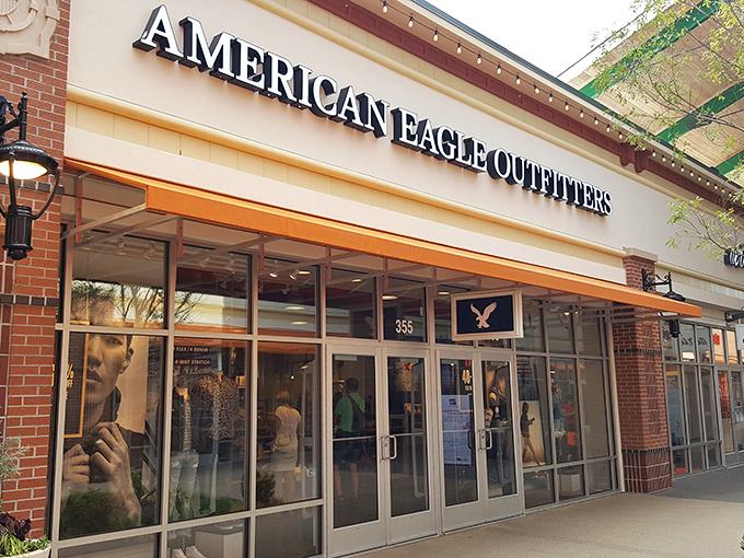 American Eagle Outfitters beckons shoppers with promises of casual cool. The mannequins inside are judging your current outfit choices.
