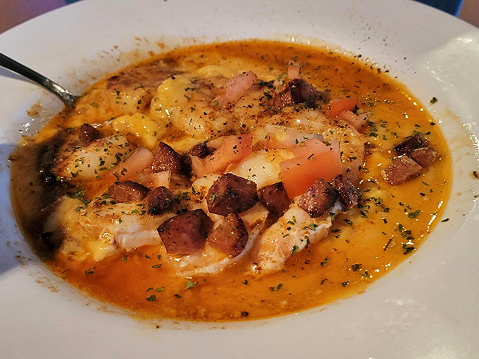 This isn't just shrimp and grits—it's a Southern symphony in a bowl, where smoky sausage plays harmony to plump shrimp and creamy comfort.
