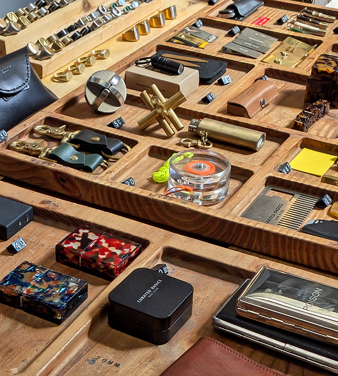 Meticulously organized treasures await in wooden compartments – each tiny object telling its own story of craftsmanship.