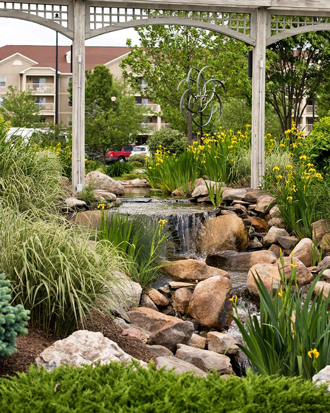 This tranquil waterfall garden isn't whispering "you're getting older"&mdash;it's murmuring "you've earned this slice of serenity."