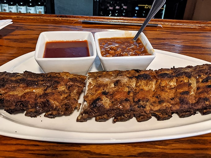 These ribs aren't just smoked; they're transformed into something transcendent. The two sauce options are like choosing between two perfect sunsets.
