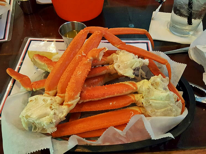 Snow crab legs arranged like nature's perfect puzzle. The ocean's treasure chest has been unlocked, and butter is the golden key.