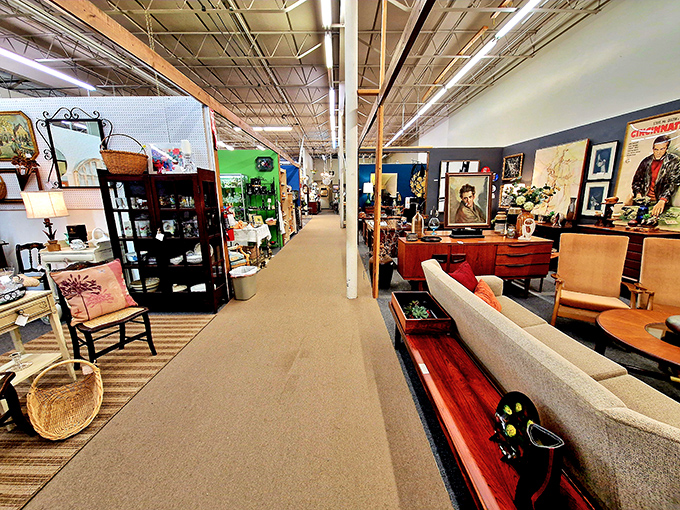 Mid-century modern meets contemporary comfort in this display. Don Draper would approve of that sleek sofa, though he'd insist on keeping an Old Fashioned nearby.